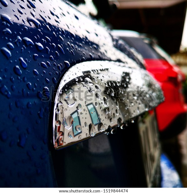 Reflection on a mini with raindrops - Stock Image - Everypixel