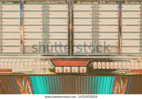 Retro styled image of an old jukebox with empty music labels