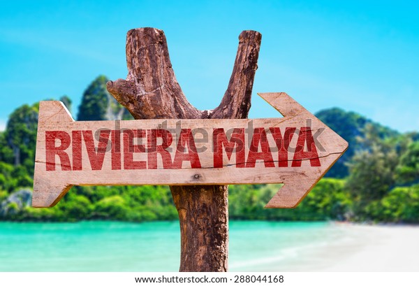 Riviera Maya wooden sign with beach background Riviera Maya wooden sign with beach background