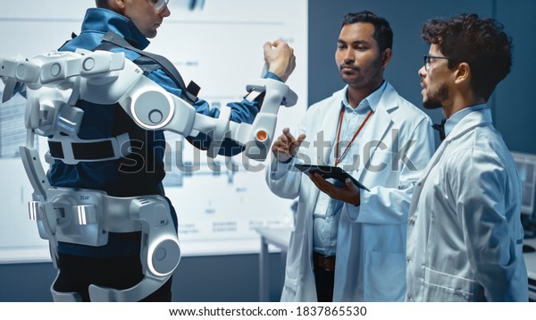 In Robotics Development Laboratory: Engineers and Scientists Work on a ...