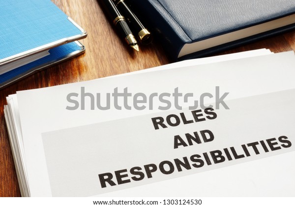 Roles Responsibilities Documents On Desk Stock Photo (Edit Now) 1303124530