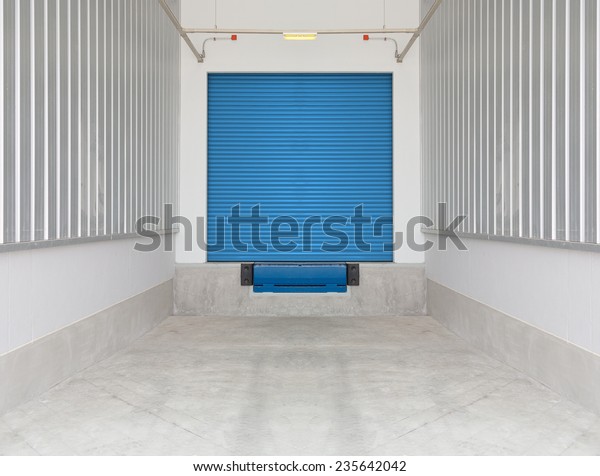 Roller Shutter Door Dock Leveler Ramp Stock Photo (Edit Now) 235642042