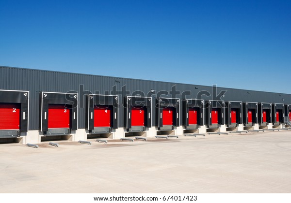 Row Loading Docks Shutter Doors Warehouse Stock Photo (Edit Now) 674017423