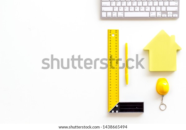 ruler, keyboard, house figure, tools for architect work on white desk ... ruler, keyboard, house figure, tools for architect work on white desk ...