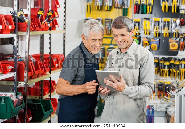 Salesperson Customer Using Tablet Computer Hardware Stock Photo ...