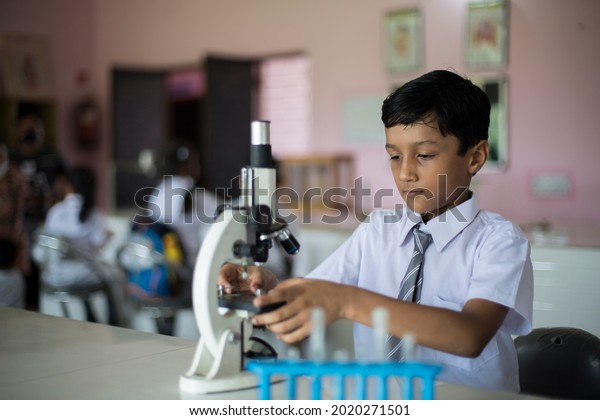 School Boy Looking Through Microscope Chemistry Stock Photo 2020271501 ...