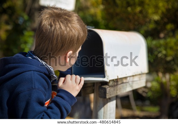 School Boy Opening Post Box Checking Stock Photo (Edit Now) 480614845