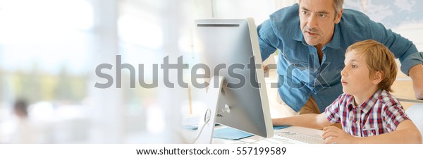 Schoolboy Computer Lab Teacher Helping Stock Photo (Edit Now) 557199589