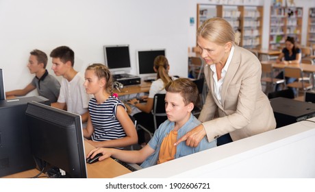 Schoolchildren Female Teacher Working Computers Classroom Stock Photo ...