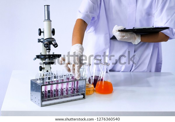 Scientist Doing Research Microscope Hand Holding Stock Photo 1276360540 ...