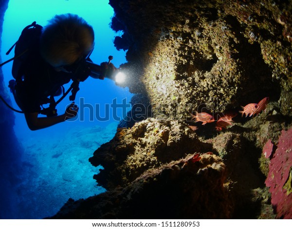 Scuba Diver Exploring Discovering Caves Underwater Stock Photo ... Scuba Diver Exploring Discovering Caves Underwater Stock Photo ...