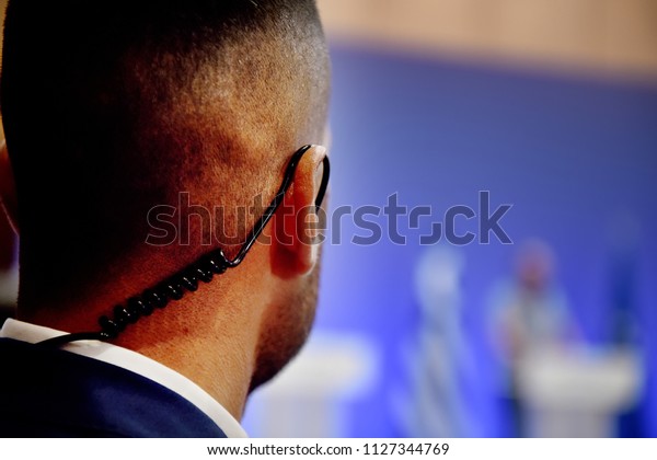 Security Guard Wears Ear Headset During Stock Photo 1127344769 ...