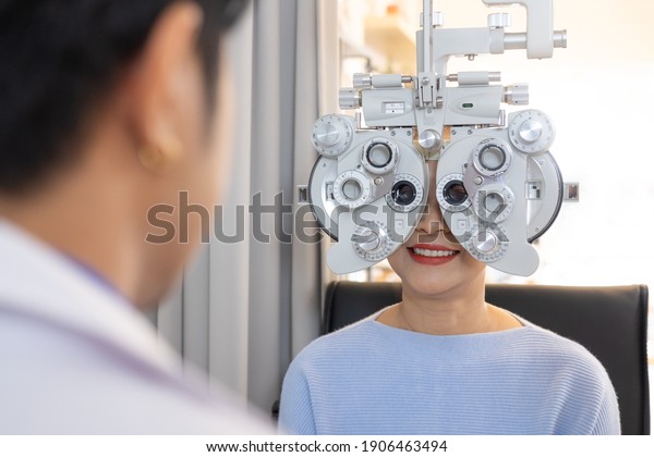 Selective focus at Optometry frame equipment. While doctor using ...