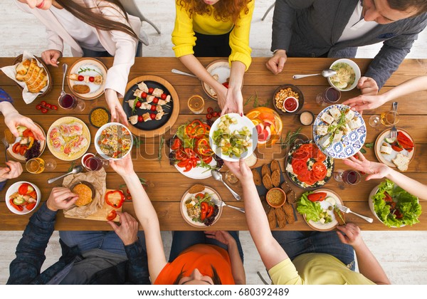 Served table top view, dinner. People eat healthy food together, home party