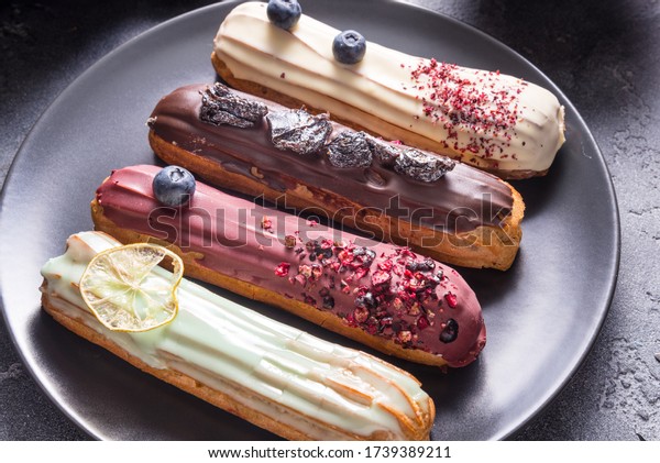 Set Different Eclair Cakes On Dark Stock Photo 1739389211 | Shutterstock