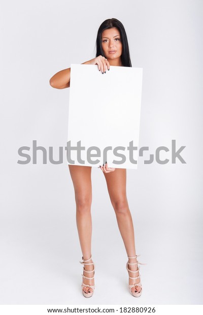 Стоковая фотография 182880926 Sexy Naked Girl Holding Vertical Blank