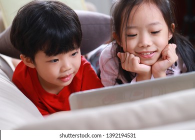 Siblings Using Computer Showing Each Other Stock Photo 1392194531 ...