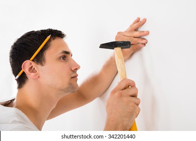 Side View Young Man Hammering Nail Stock Photo 342201440 | Shutterstock