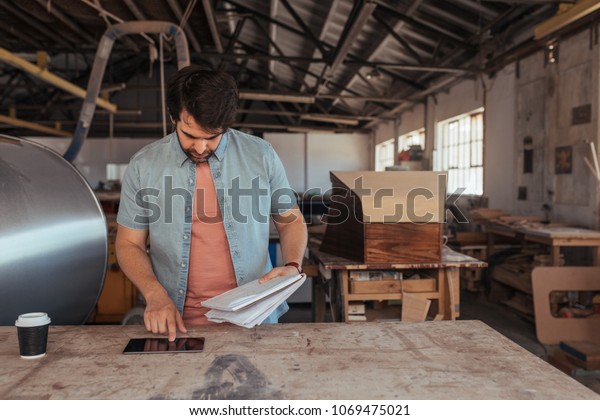 Skilled Young Woodworker Standing Workbench His Stock Photo 1069475021 ...