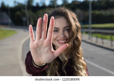 Smiling Girl Doing Stop Symbol On Stock Photo 1220180098 | Shutterstock