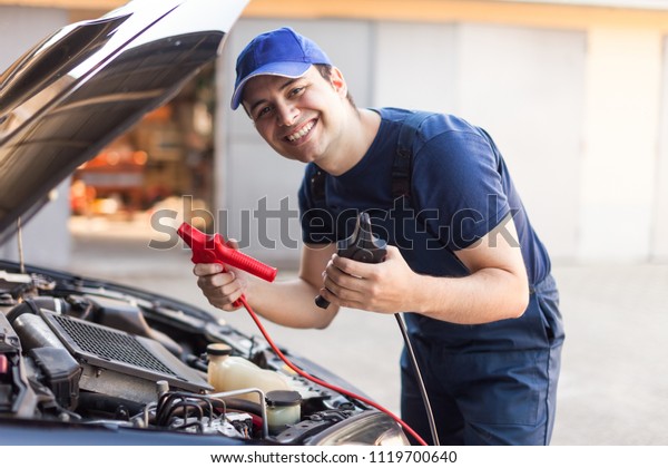 Smiling Mechanic Using Cables Start Car Stock Photo 1119700640 ...