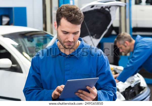 Smiling Mechanic Using Tablet Pc Repair Stock Photo 249165850 ...