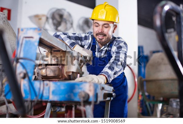 Smiling Working Man Practicing His Skills Stock Photo 1519008569 ...