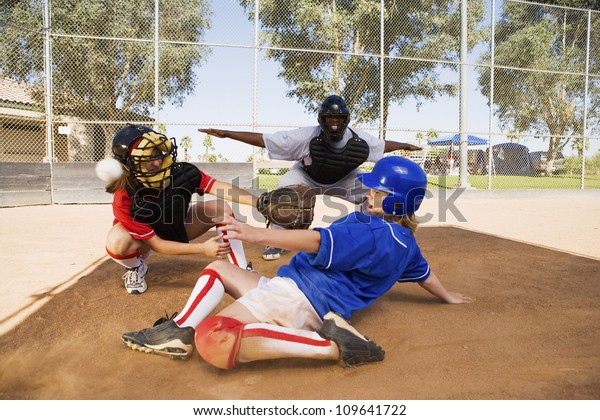 Softball Player Sliding Into Base Baseman Stock Photo (Edit Now) 109641722