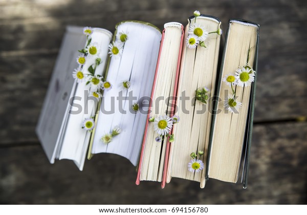 Stack Books Flowers Between Pages On Stock Photo (Edit Now) 694156780