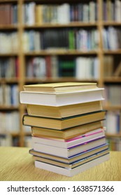 Book Stack On Wood Desk Blurred Stock Photo (Edit Now) 569895262