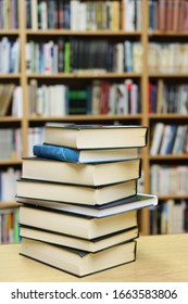 Book Stack On Wood Desk Blurred Stock Photo 1017025384 | Shutterstock