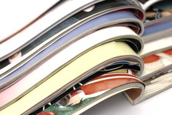Magazine with open pages up featuring advertisement, background, and ...