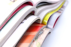 Magazine with open pages up featuring advertisement, background, and ...