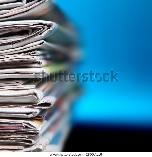 Stack Newspaper On Blue Background Stock Photo (Edit Now) 29007118