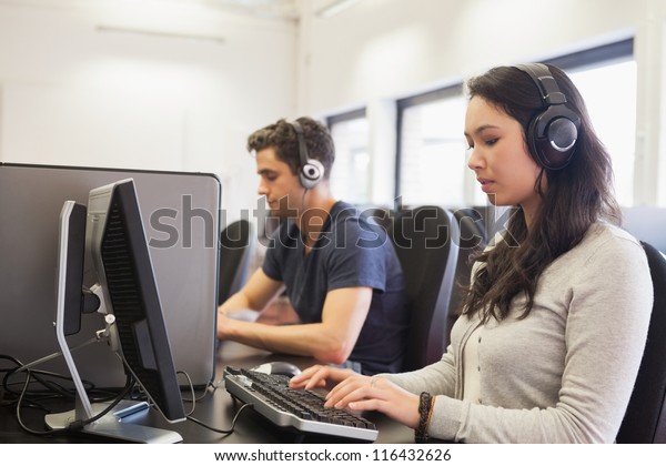 Students Working Computer Class Wearing Headphones Stock Photo ...