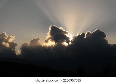 Sun Rays Through Clouds Sunsets Behind Stock Photo 2150957585 ...