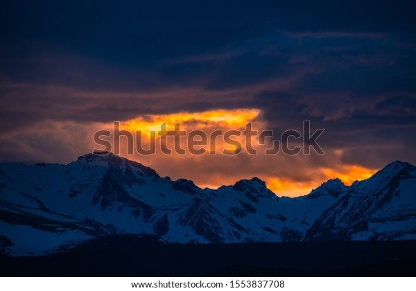 Sunlight Leaking Through Clouds Over Rocky Stock Photo 1553837708 ...
