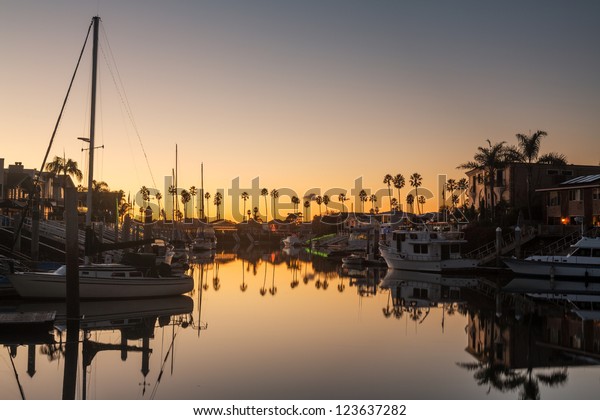 Sunset Over Residential Development By Water Stock Photo 123637282 ...
