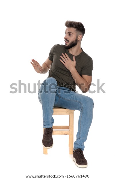 Surprised Casual Man Apologizing While Sitting Stok Fotoğrafı ...