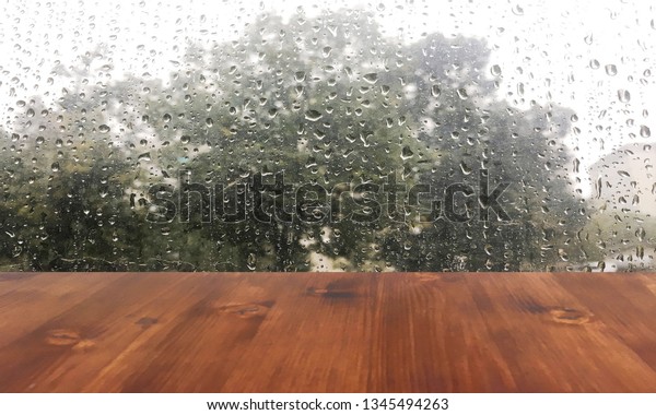 Table On Rainy Window Background Your Stock Photo (Edit Now) 1345494263