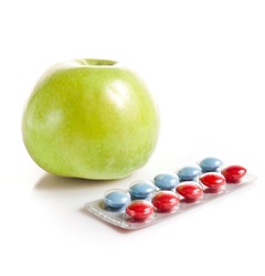Health care concept fruits ore featuring pills, vitamin, and food, a ...