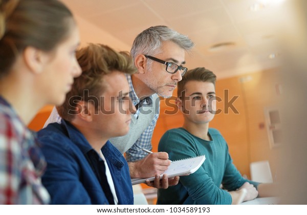 Teacher Controlling Students Work Class Stock Photo 1034589193 ...