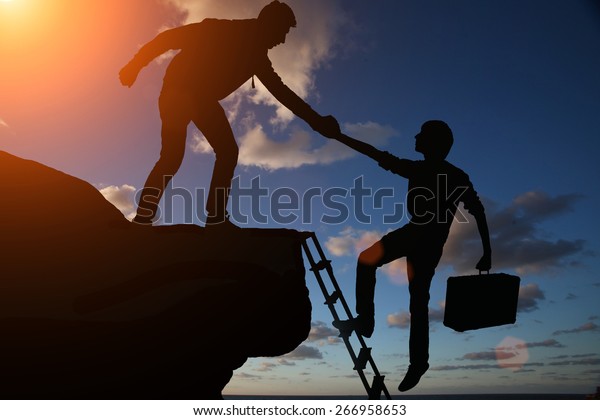Teamwork Two Men Helping Each Other Stock Photo (Edit Now) 266958653
