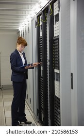 Technician Working On Servers Using Tablet Stock Photo 210586153 ...