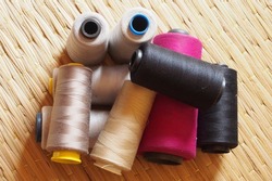 Colored sewing threads background, an Abstract Photo by PhotoVector