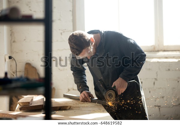 Tradesman Protective Clothes Using Angle Grinder Stock Photo (Edit Now ...