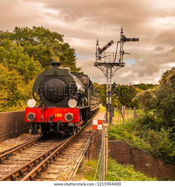 Train Chugging Down Track Stock Photo 1215904600 | Shutterstock