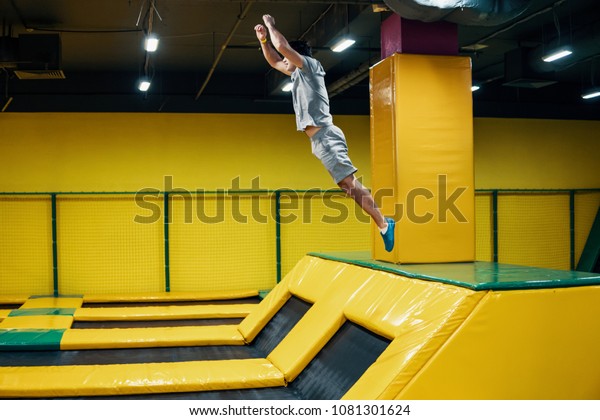 Trampoline Jumper Performs Complex Acrobatic Exercises Stock Photo ...