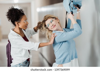 Two Aggressive Multicultural Students Fighting Corridor Stock Photo ...