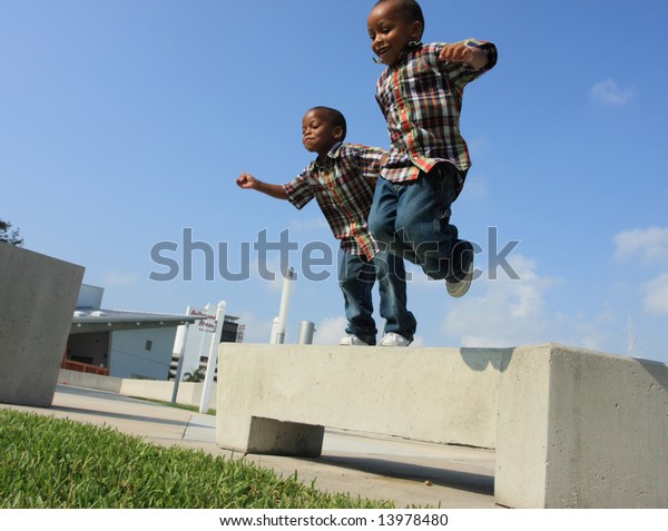 Two Boys Jumping Bench Foto stock 13978480 | Shutterstock Two Boys Jumping Bench Foto stock 13978480 | Shutterstock
